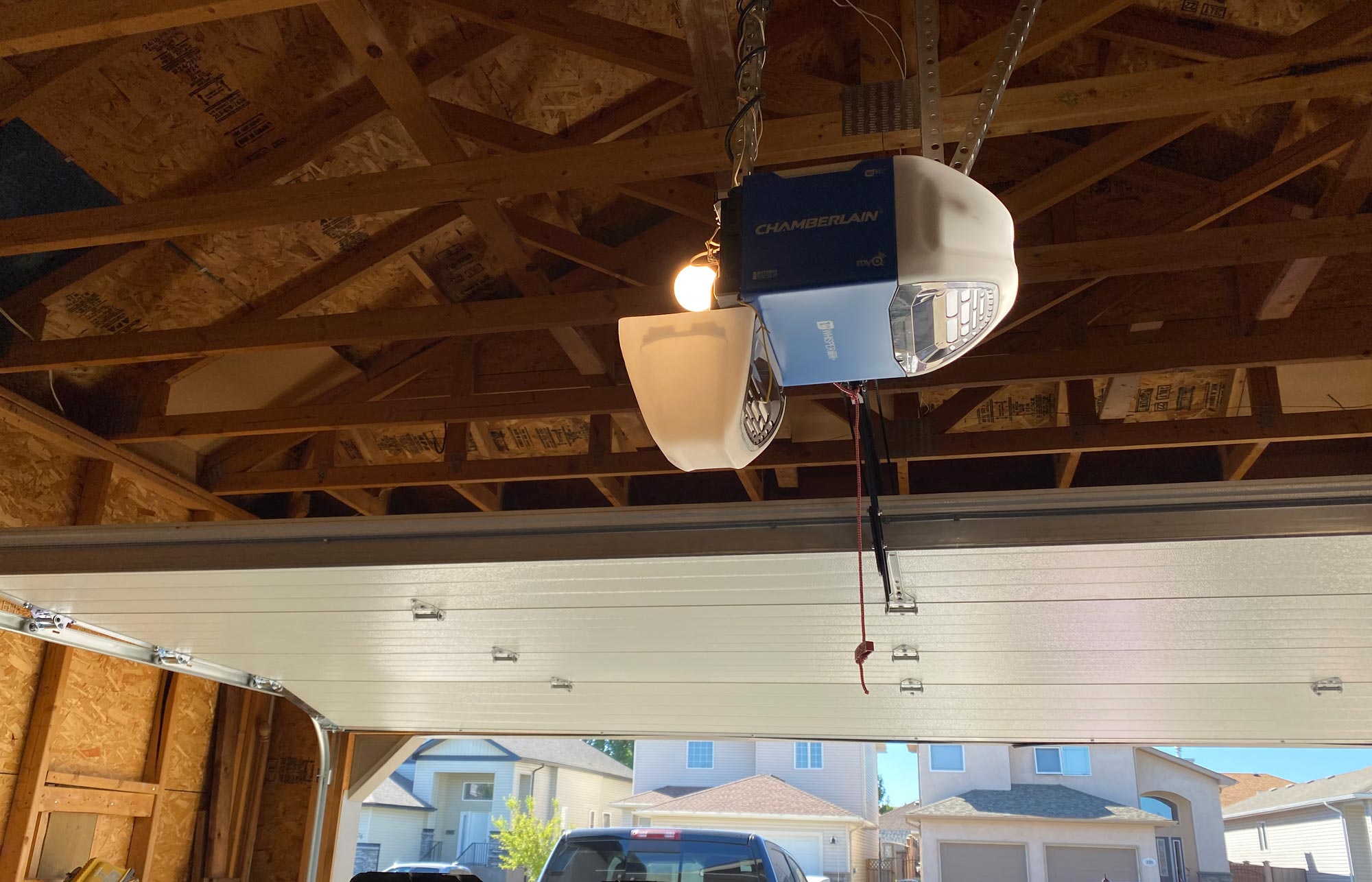 Garage Door Openers - Pros and Cons of Side Mount vs. Trolley