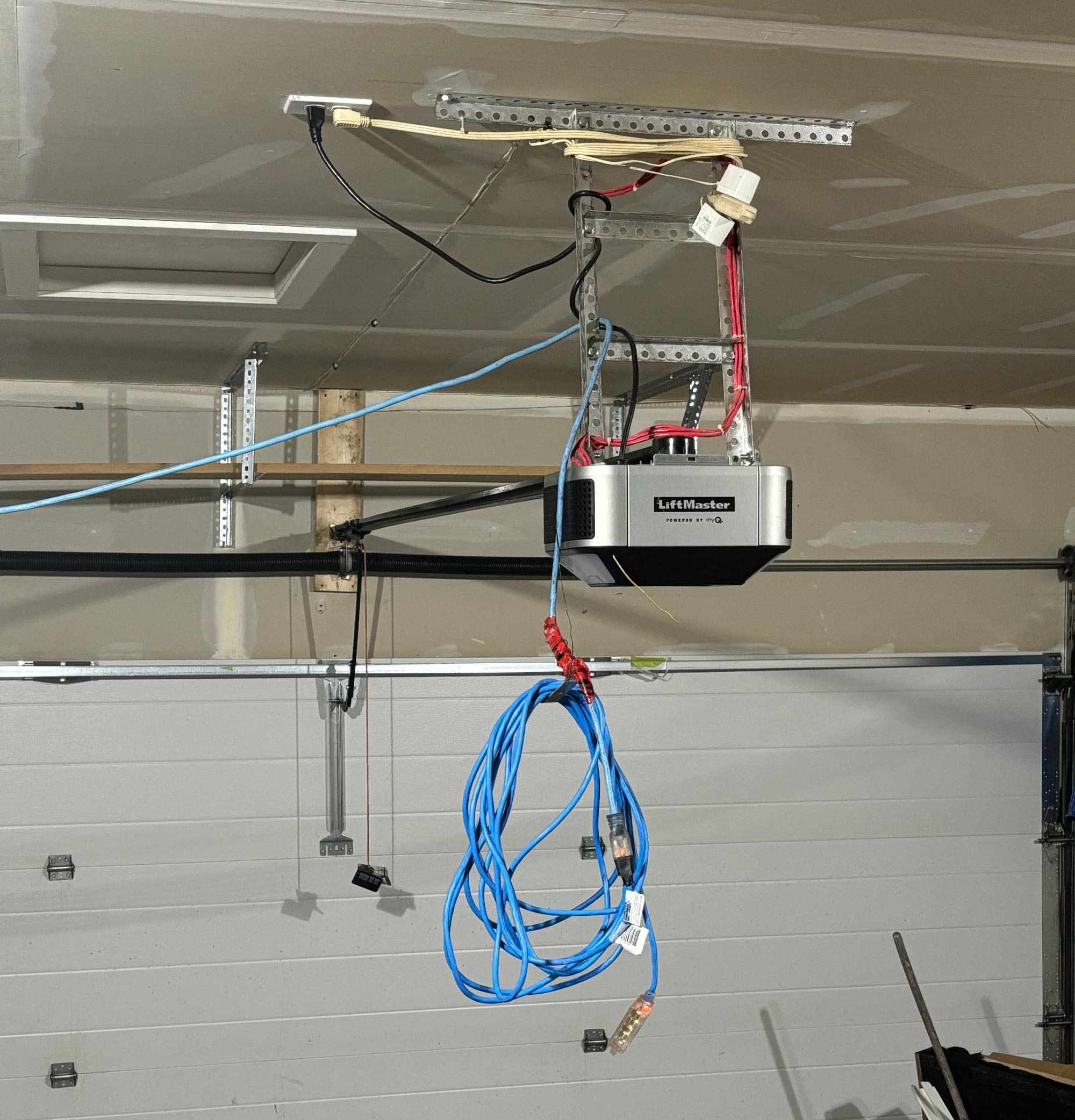 Garage Door Openers - Pros and Cons of Side Mount vs. Trolley